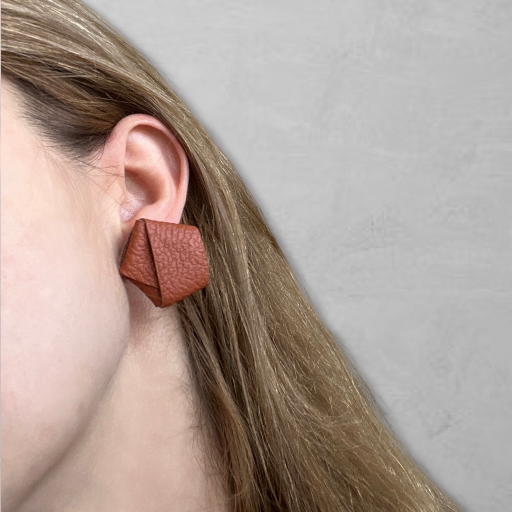 Origami grainy rust brown leather stud earrings – London Atelier Byproduct
